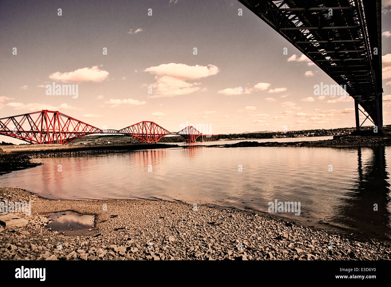 The Forth Bridges in Scotland. Shot from under the road bridge, on the ...