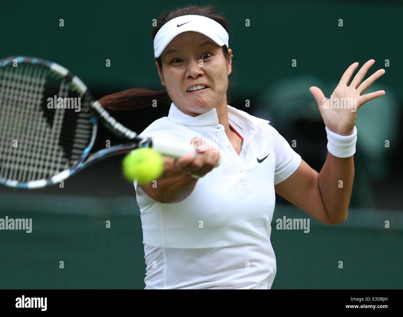 London, UK. 23rd June, 2014. Li Na of China hits a return to Paula ...