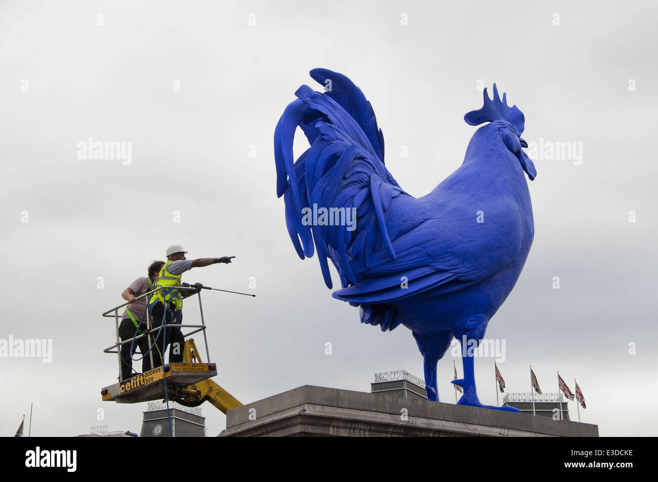 A blue French cockerel by German artist Katharina Fritsch is cleaned ...