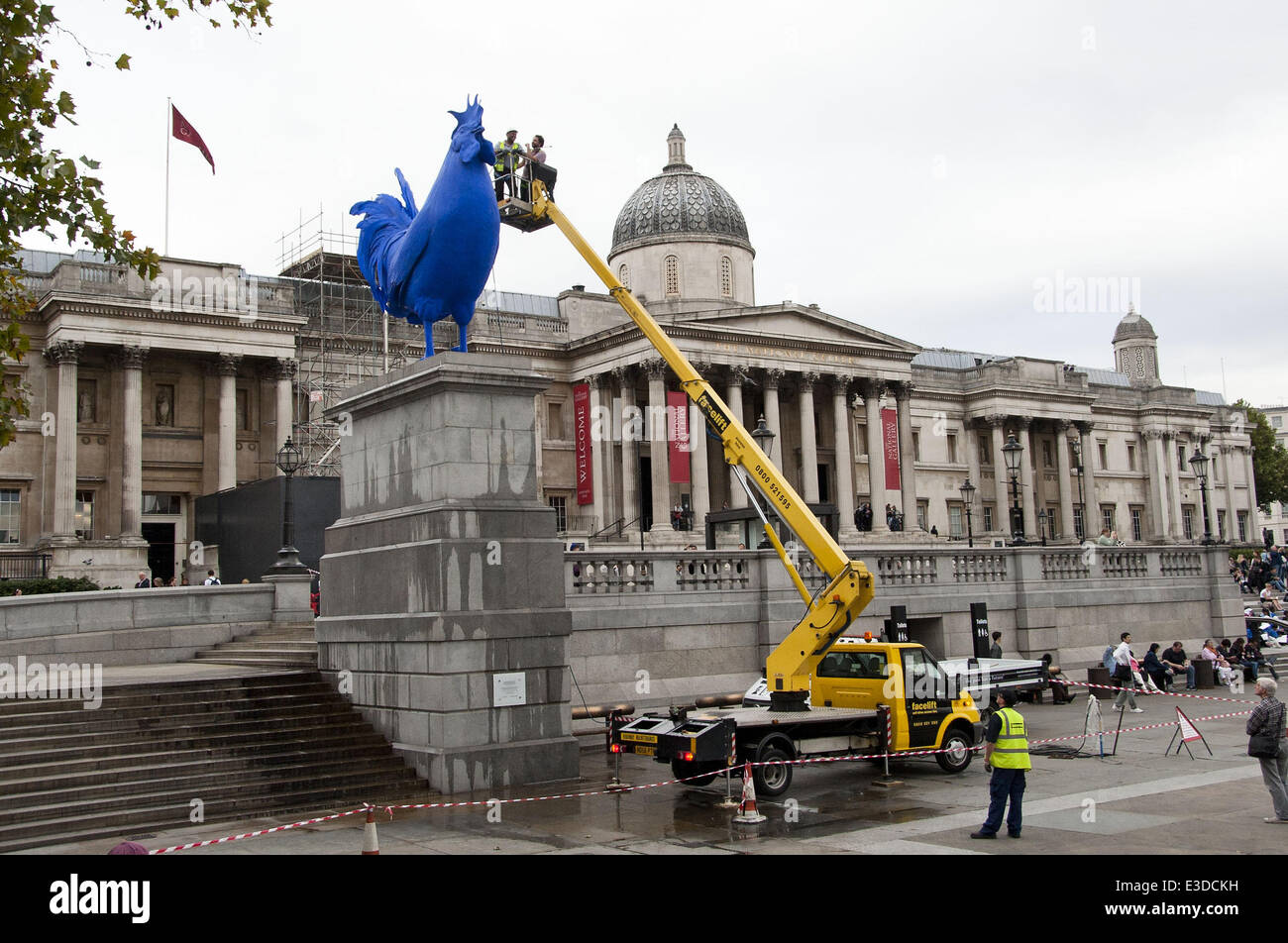 A blue French cockerel by German artist Katharina Fritsch is cleaned ...