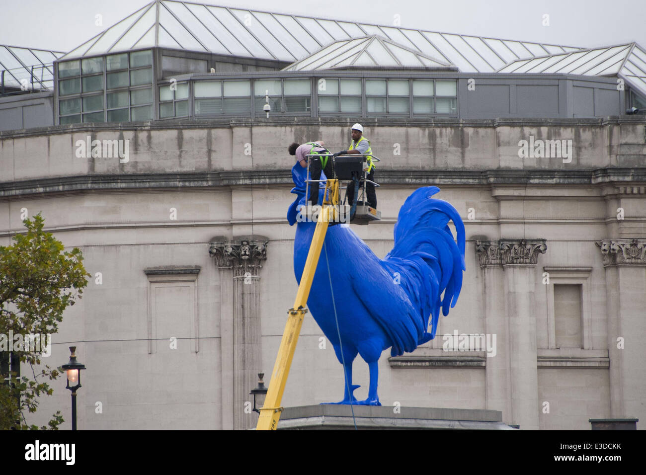A blue French cockerel by German artist Katharina Fritsch is cleaned ...