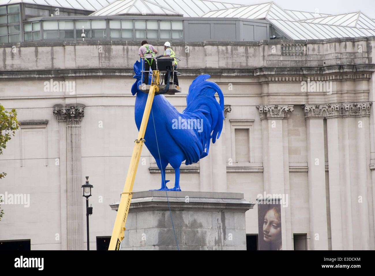 A blue French cockerel by German artist Katharina Fritsch is cleaned ...