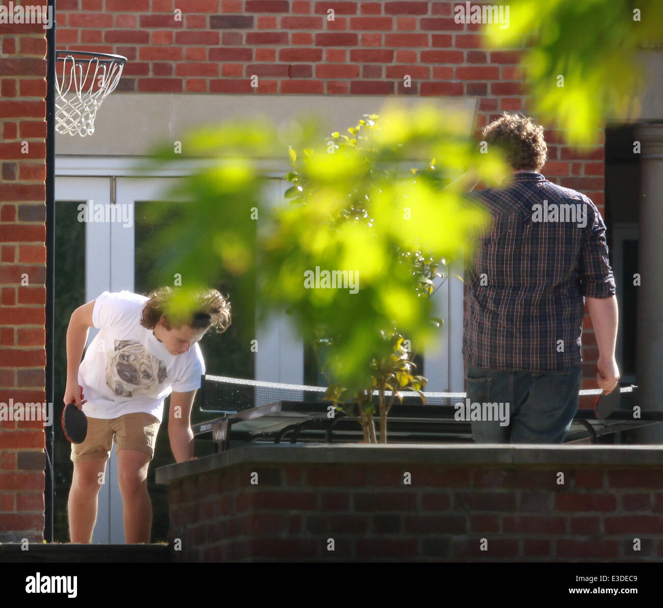 Shelley Smith and Luke Friend relax in the back garden of the X Factor ...