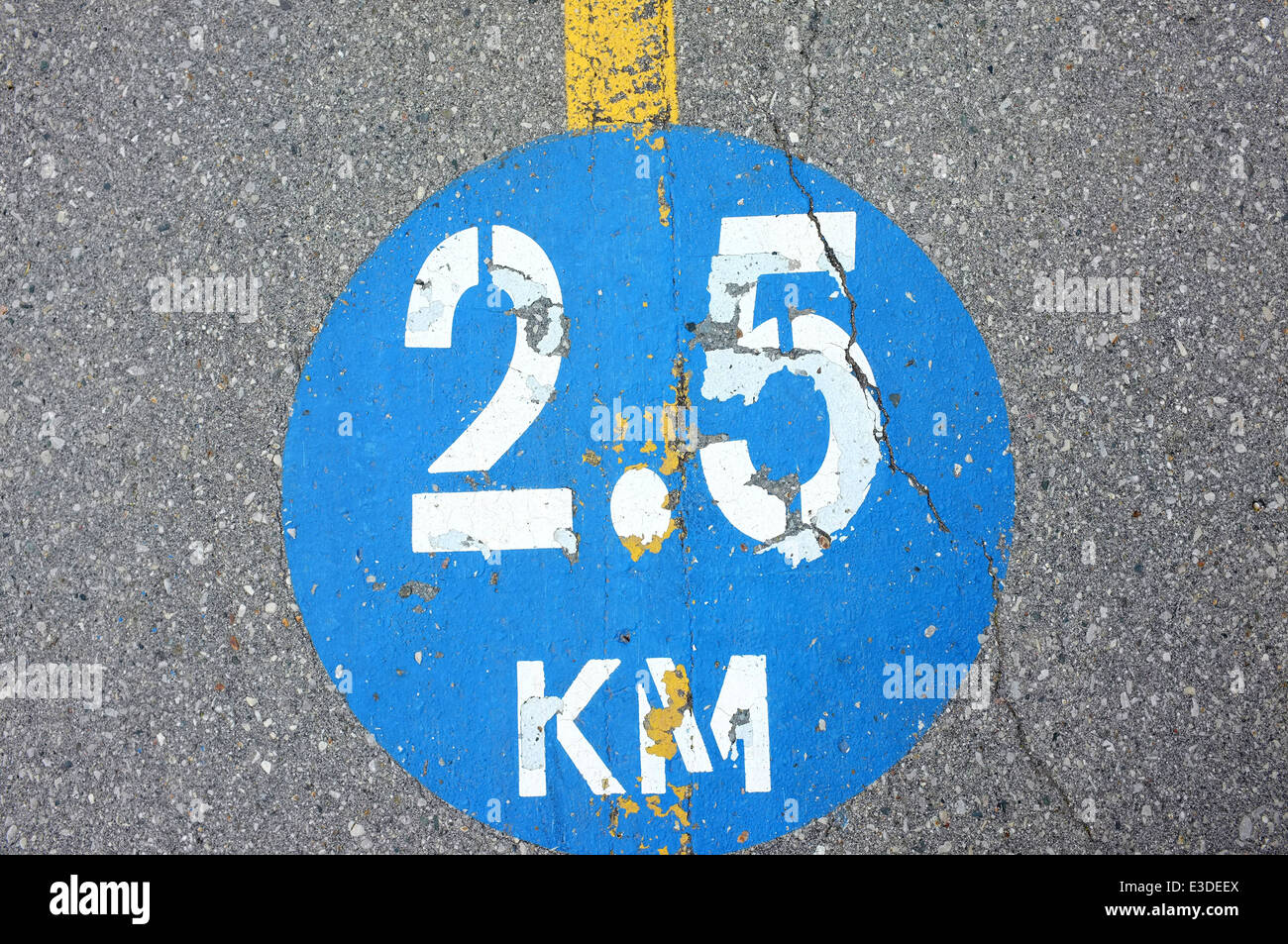 A distance marker sign painted on a cycle path in London, Ontario Stock ...