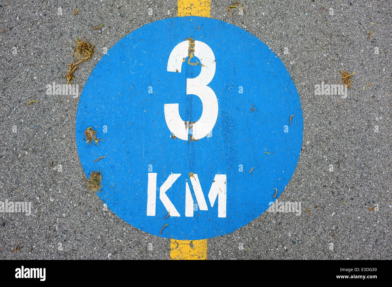 A distance marker sign painted on a cycle path in London, Ontario Stock ...