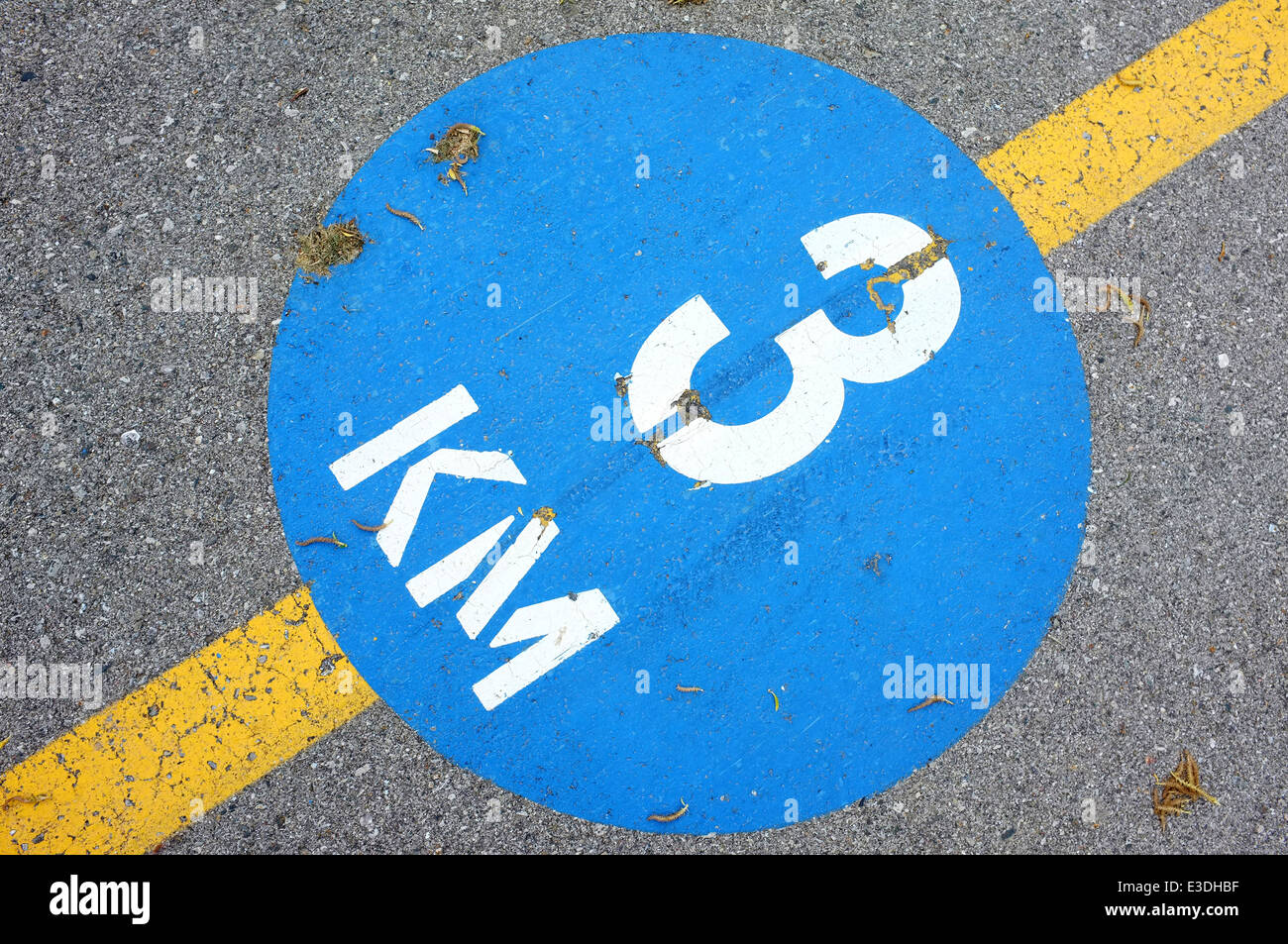 A distance marker sign painted on a cycle path in London, Ontario Stock ...