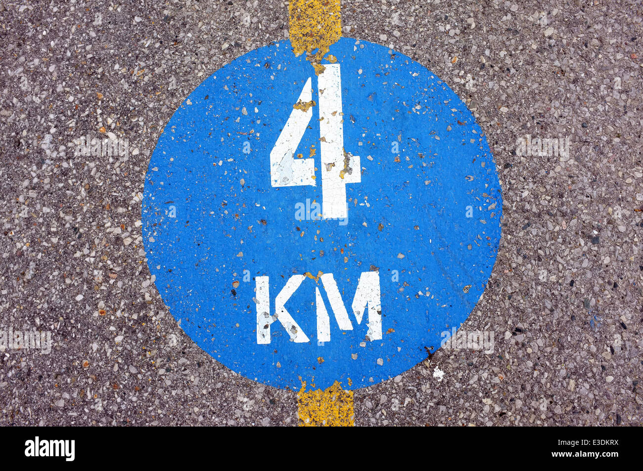 A distance marker sign painted on a cycle path in London, Ontario Stock ...