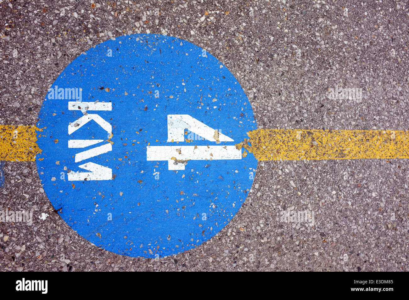 A distance marker sign painted on a cycle path in London, Ontario Stock ...
