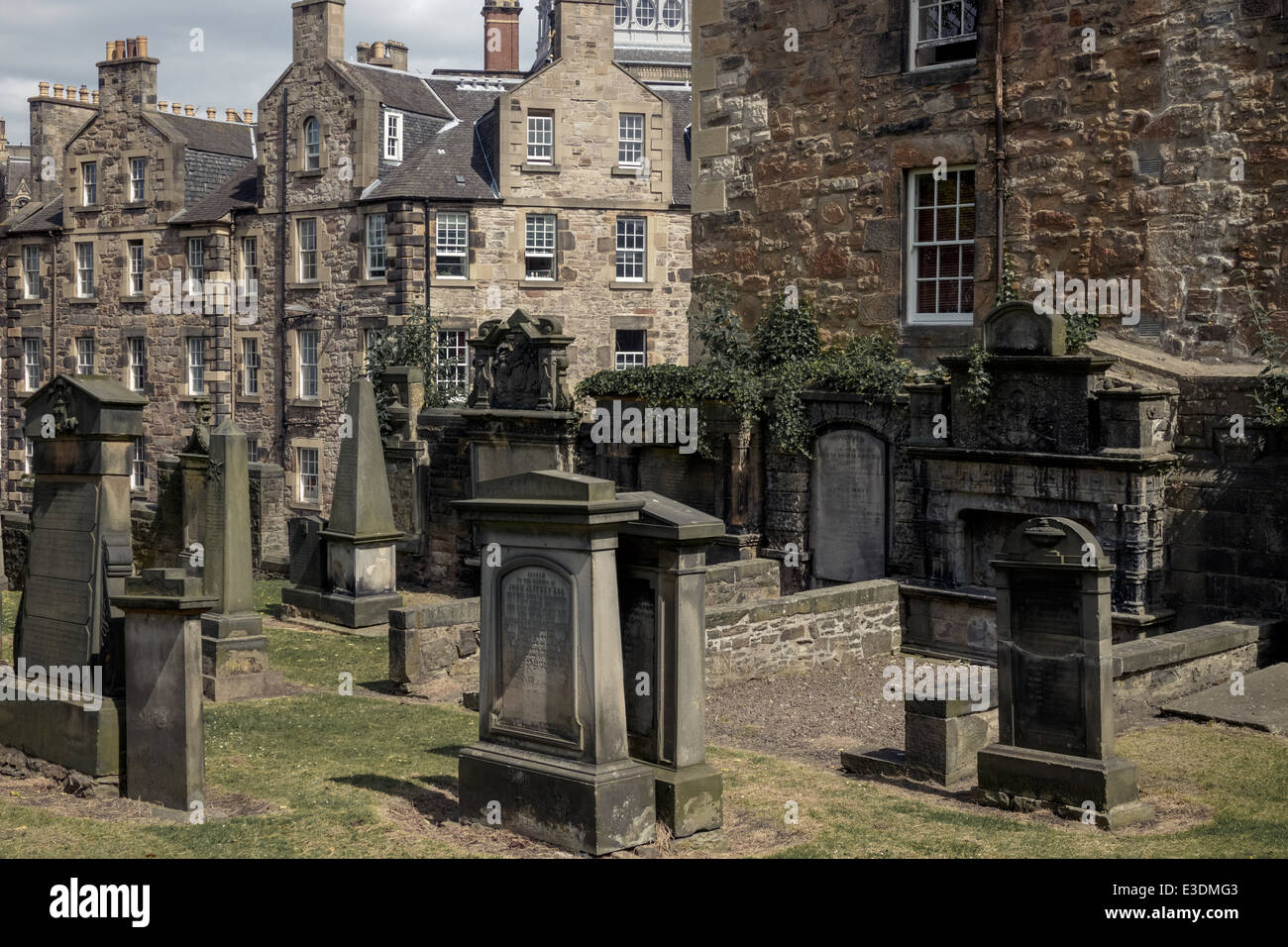 Gravestones with the traditional architecture of Edinburgh's Old Town ...