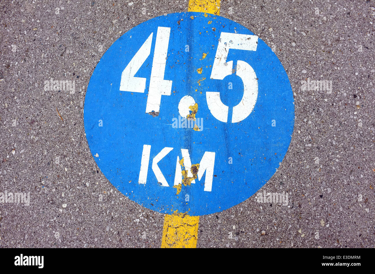 A distance marker sign painted on a cycle path in London, Ontario Stock ...