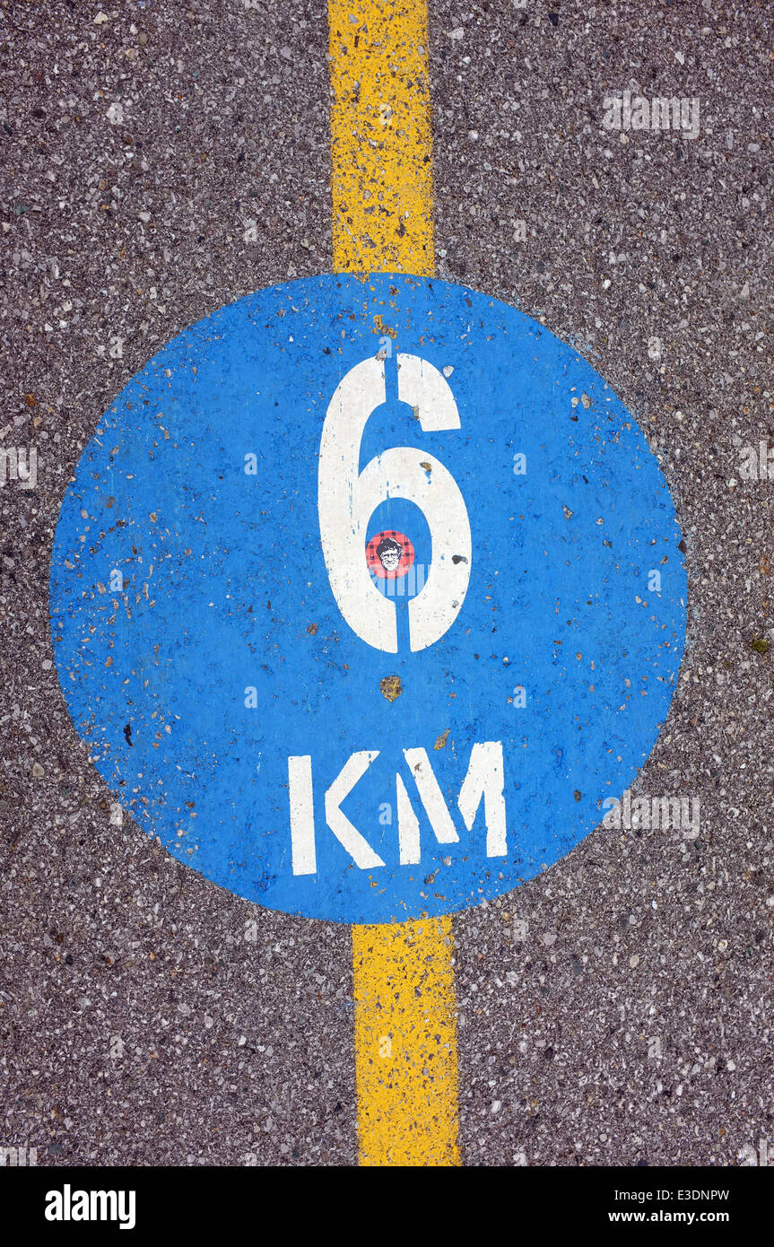 A distance marker sign painted on a cycle path in London, Ontario Stock ...