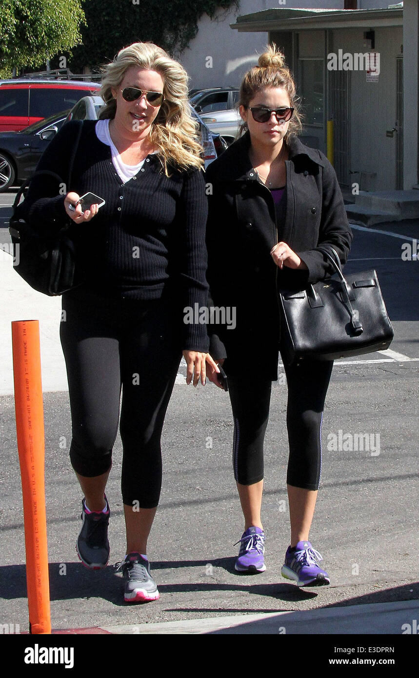 Ashley Benson, wearing a winter coat, arrives at a gym for a workout ...