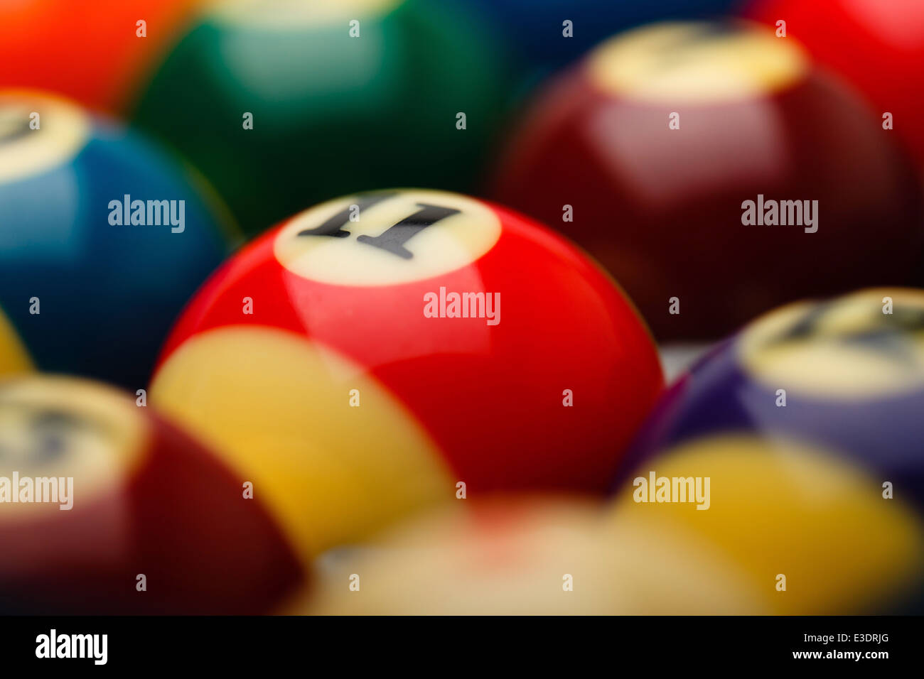 Billiard balls in box, selective focus over number 11 Stock Photo - Alamy