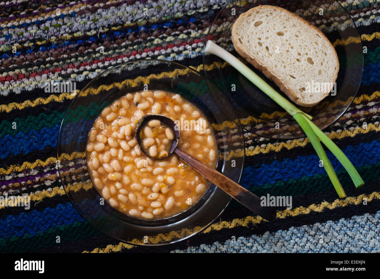 Garlic, bread, beans on a colorful rug Bulgarian, selective focus Stock ...