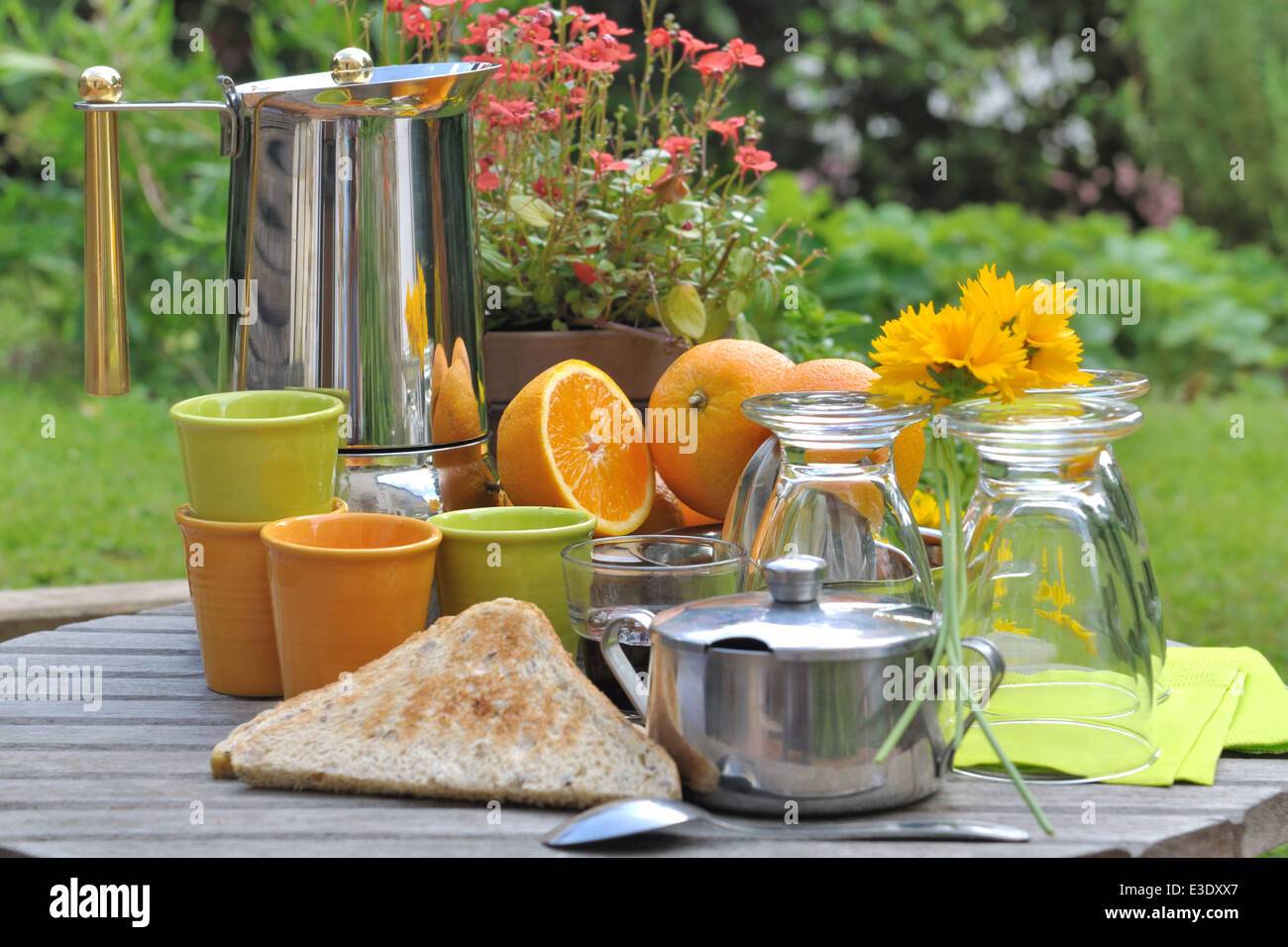 ingredients and crockery for breakfast in the garden Stock Photo - Alamy