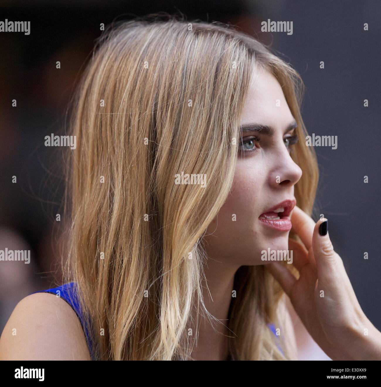 Model Cara Delevingne poses for photos at a DKNY photo shoot in Times ...