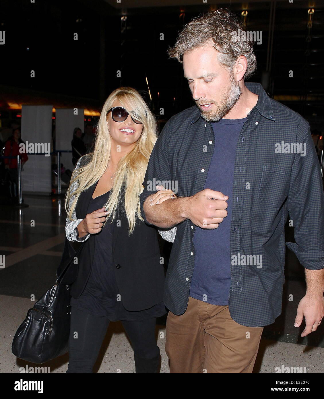 Jessica Simpson and husband Eric Johnson arrive at LAX airport to catch ...
