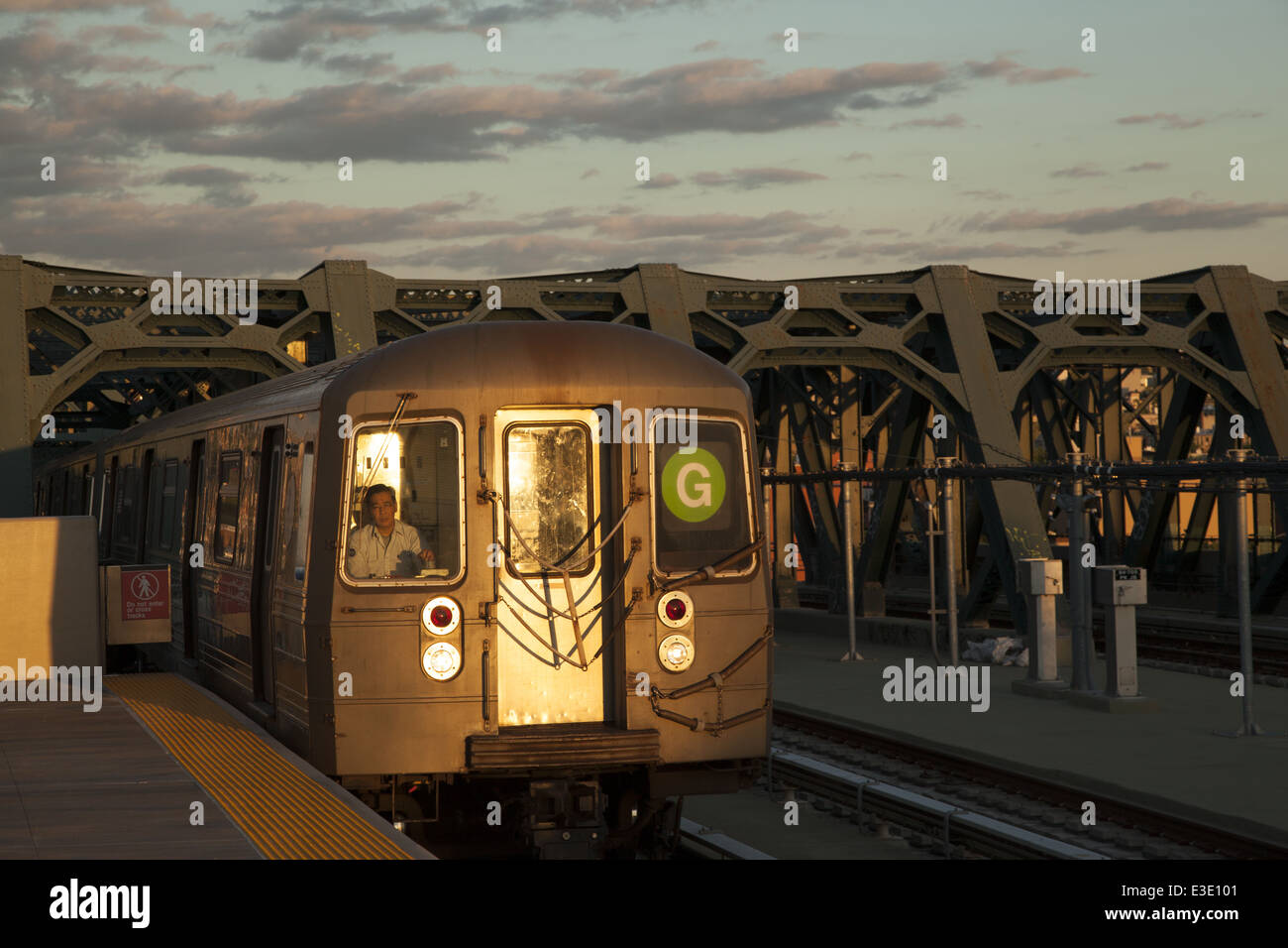 G Train enters the Smith/9th St. elevated subway station just before ...