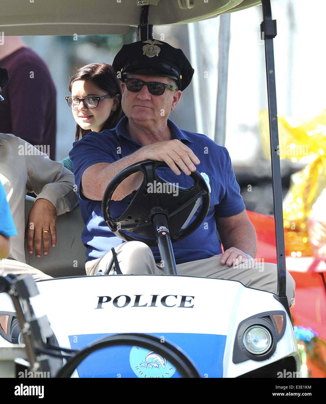 Actor Ed O'Neill arresting Ariel Winter for a scene as he plays a role ...