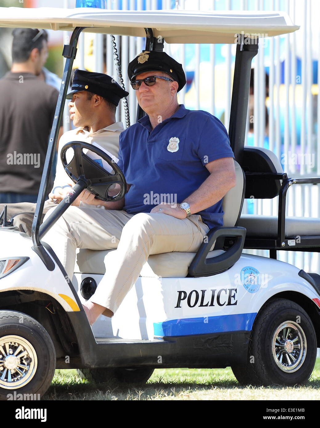 Actor Ed O'Neill arresting Ariel Winter for a scene as he plays a role ...