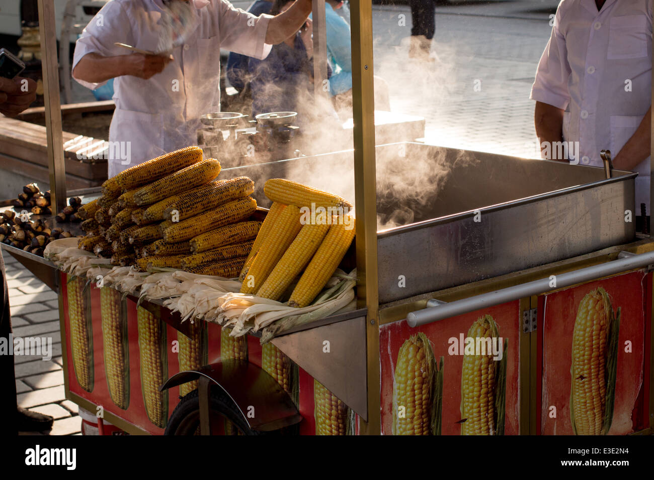 A street vendor selling freshly cooked corn on the cob Stock Photo - Alamy