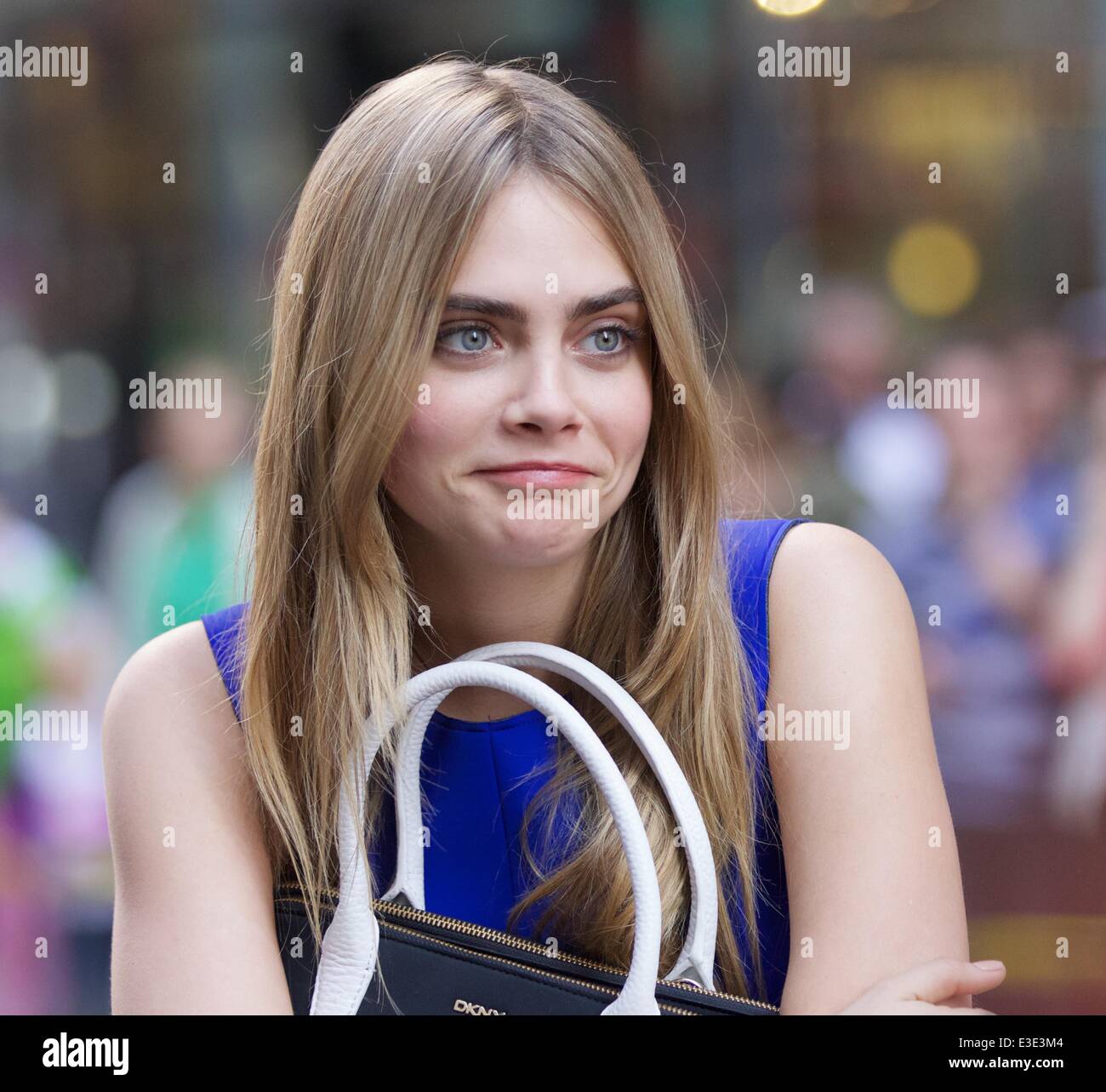 Model Cara Delevingne poses for photos at a DKNY photo shoot in Times ...