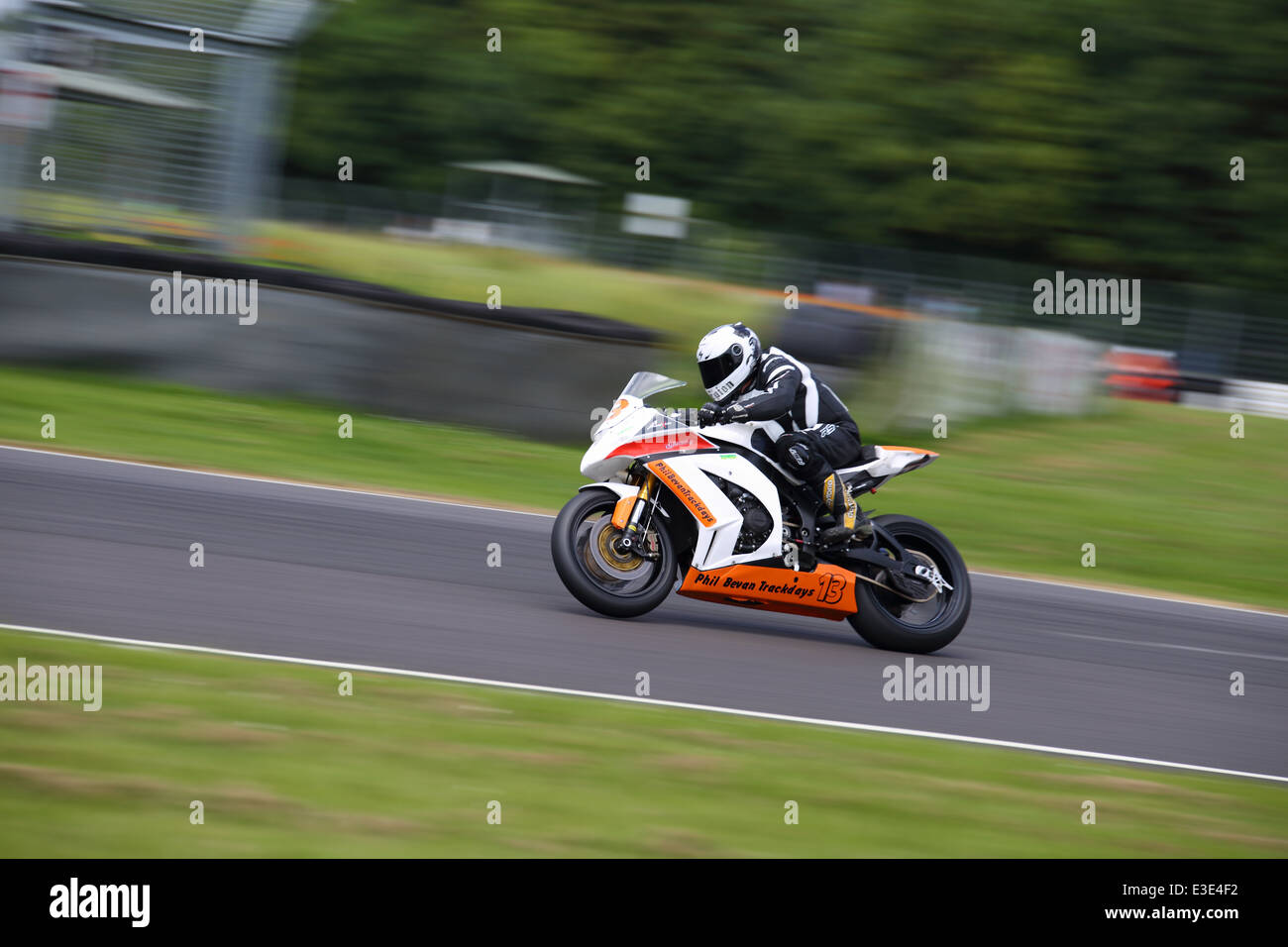 Motorcycles racing around Castle Combe Circuit at their Grand National ...