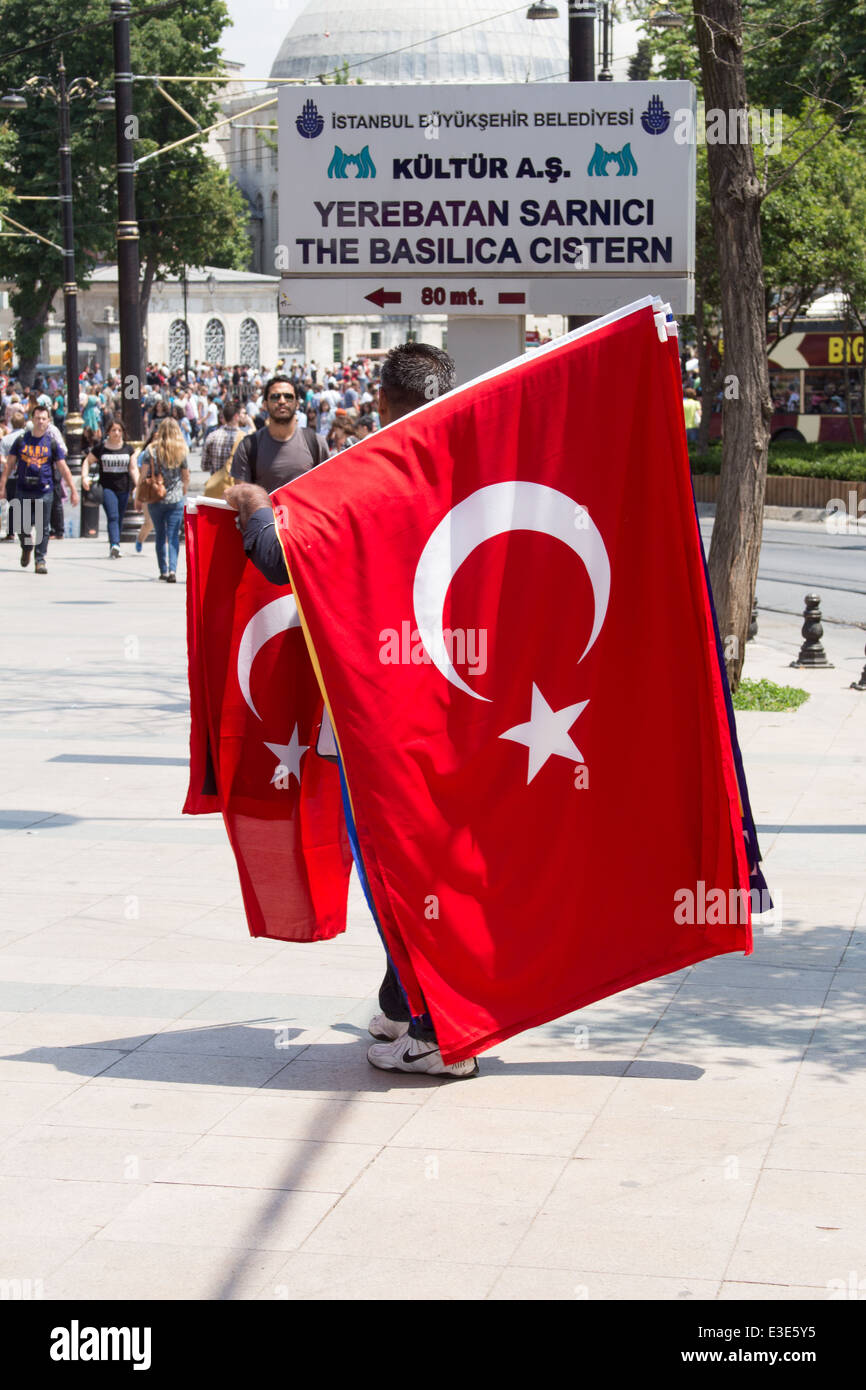 A man holding a Turkish flag outside The Basilica Cistern in Istanbul ...
