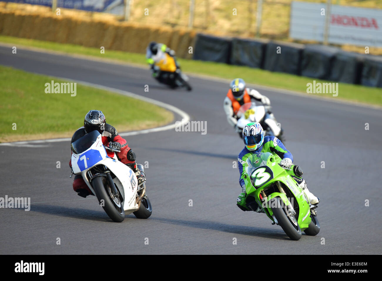 Motorcycles racing around Castle Combe Circuit at their Grand National ...