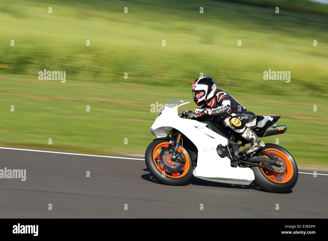 Motorcycles racing around Castle Combe Circuit at their Grand National ...