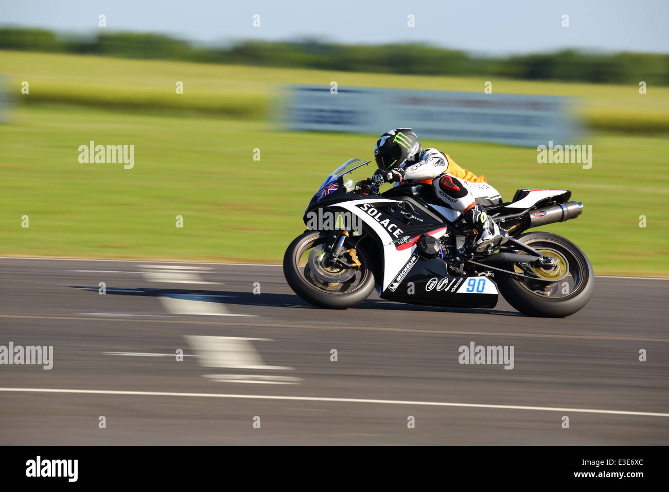 Motorcycles racing around Castle Combe Circuit at their Grand National ...