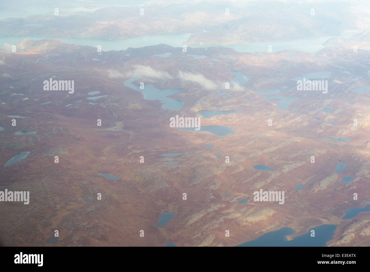 Landscape of Greenland seen from the air in summer with rocky surface ...