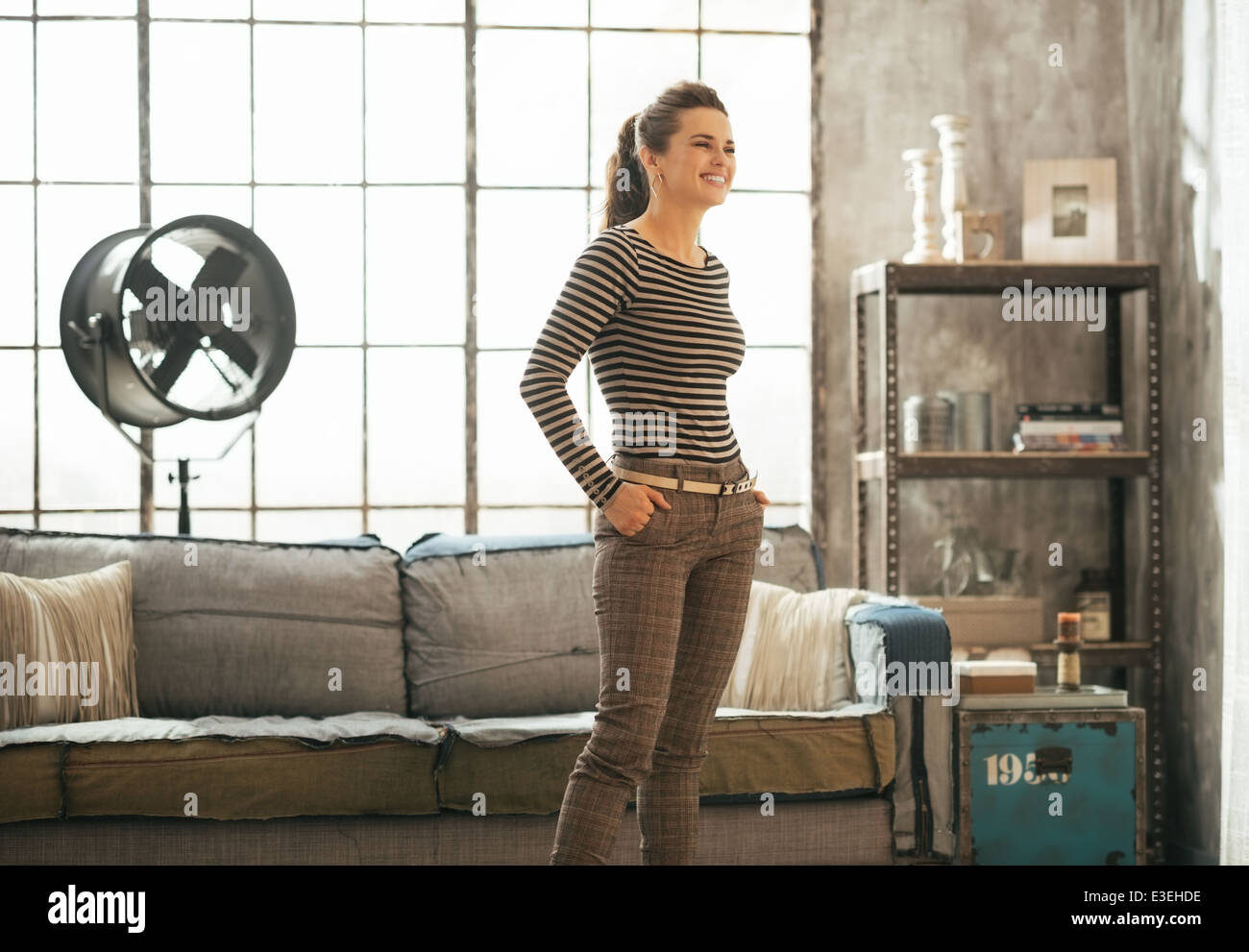 Modern loft woman standing home hi-res stock photography and images - Alamy