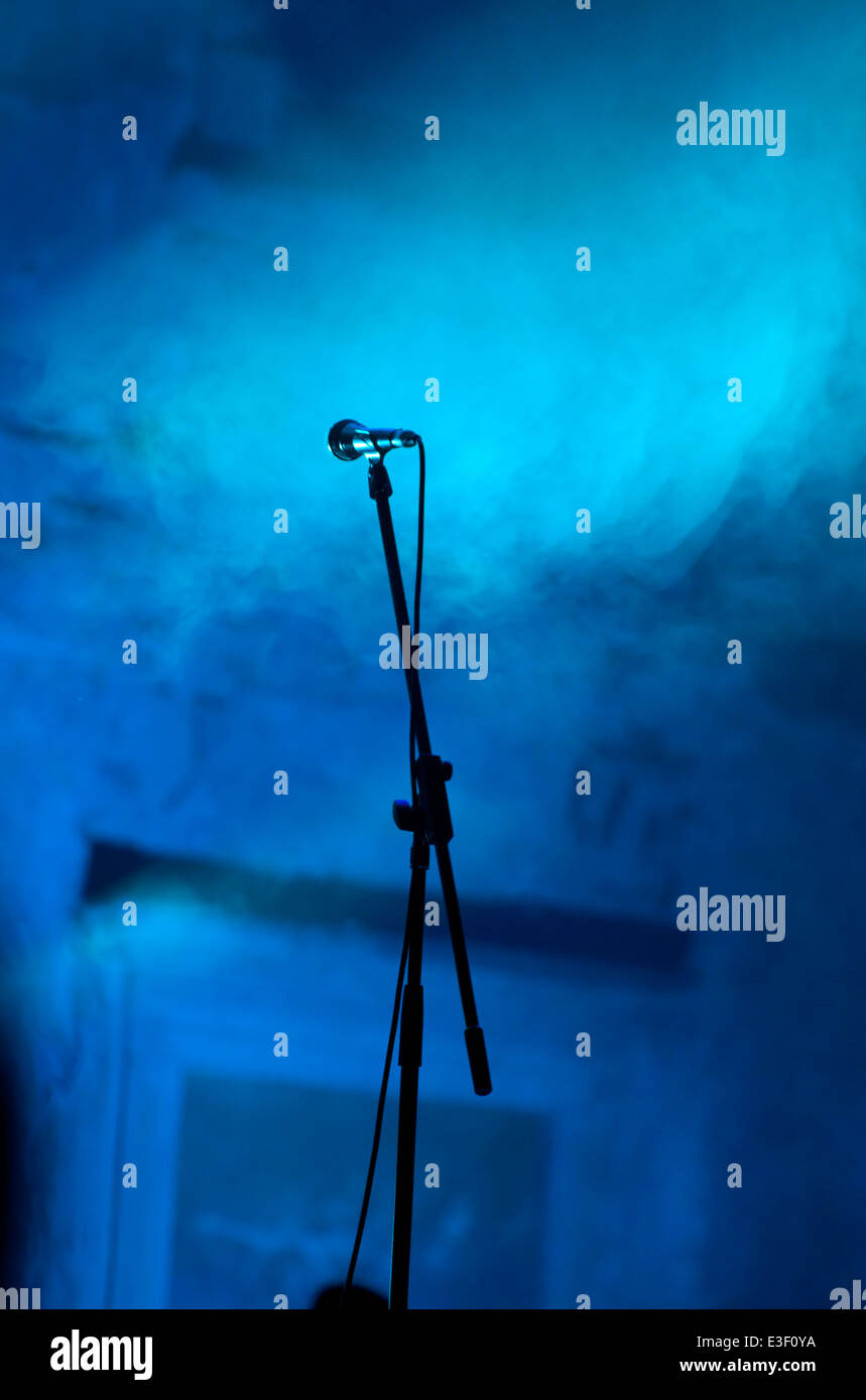 Microphone on empty stage Stock Photo - Alamy