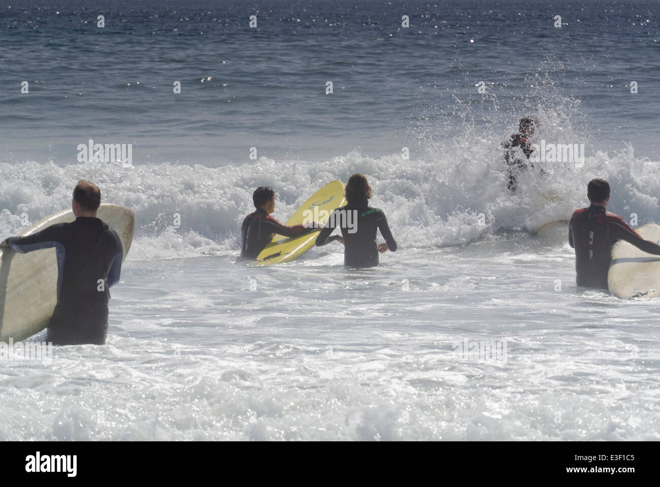 Friends experience enjoyable surfing conditions at Porth Neigwl, North ...