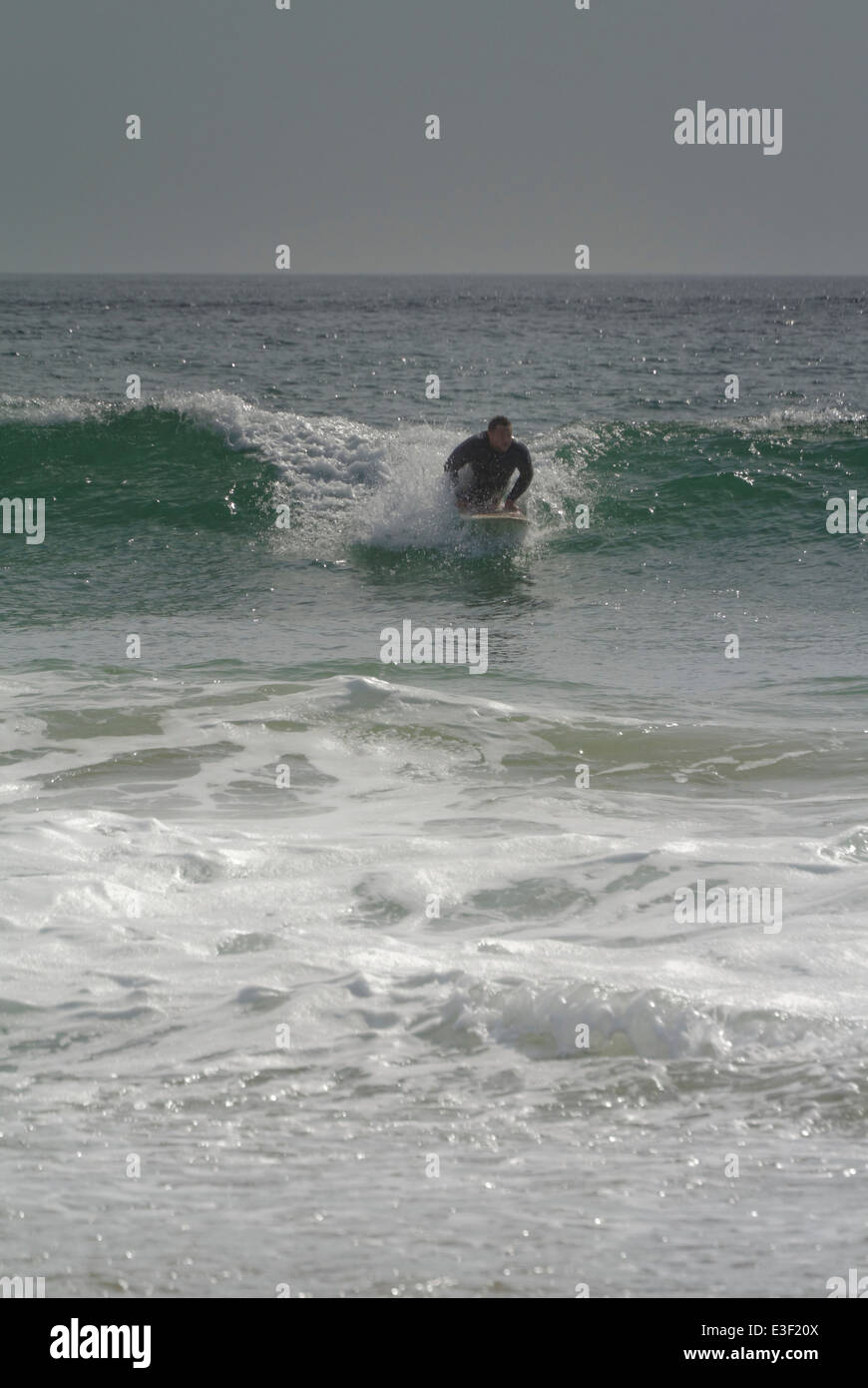 Surfing at Porth Neigwl [Hell's Mouth Bay, North Wales] in bright and ...