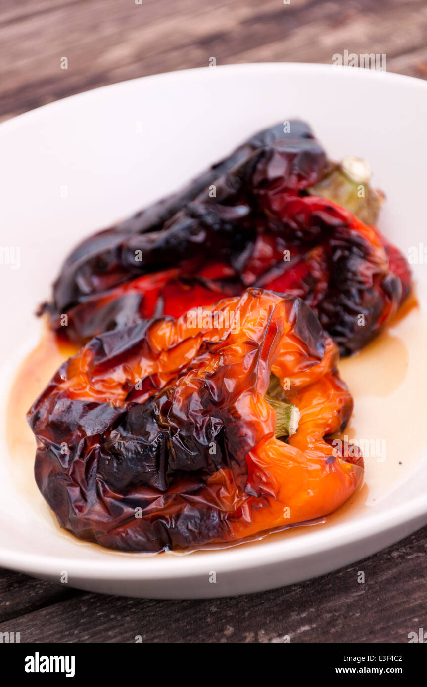 Barbecued grilled whole capsicum peppers Stock Photo - Alamy