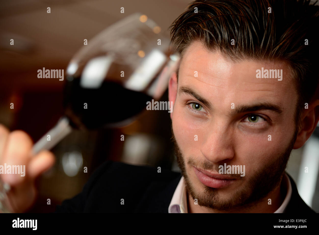 Young man with redwine glasses at celebration or party Stock Photo - Alamy