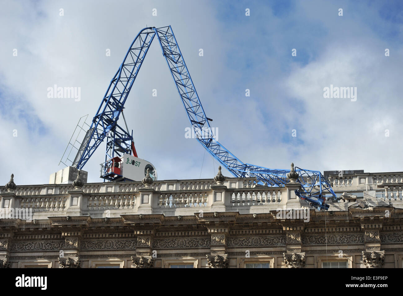 A crane over-hanging the entrance to the Cabinet Office near the gates ...
