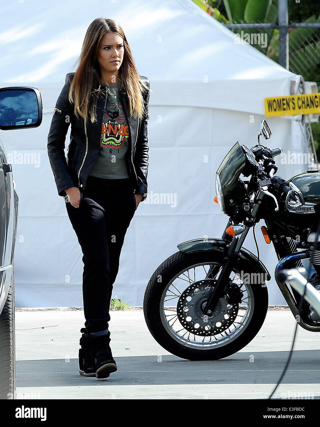 Pierce Brosnan checks out a classic motorcycle while on the set of 'How ...