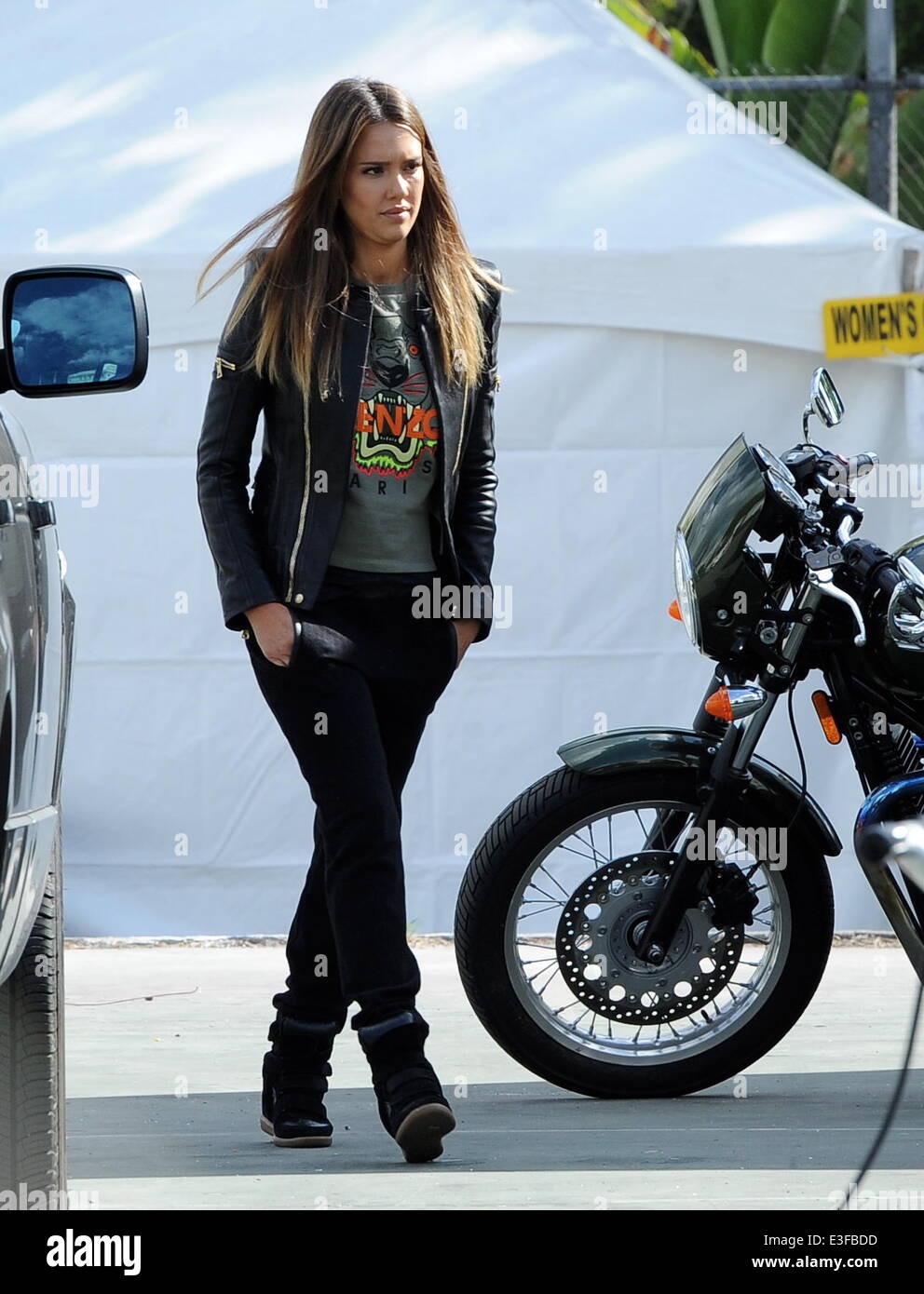 Pierce Brosnan checks out a classic motorcycle while on the set of 'How ...