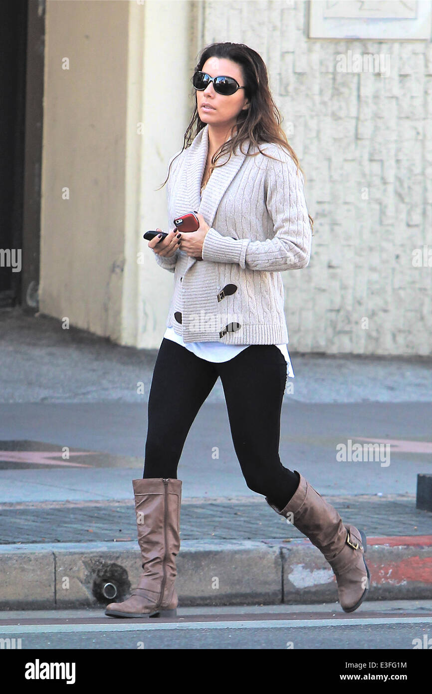 A casually dressed Eva Longoria returns to her car after visiting a ...