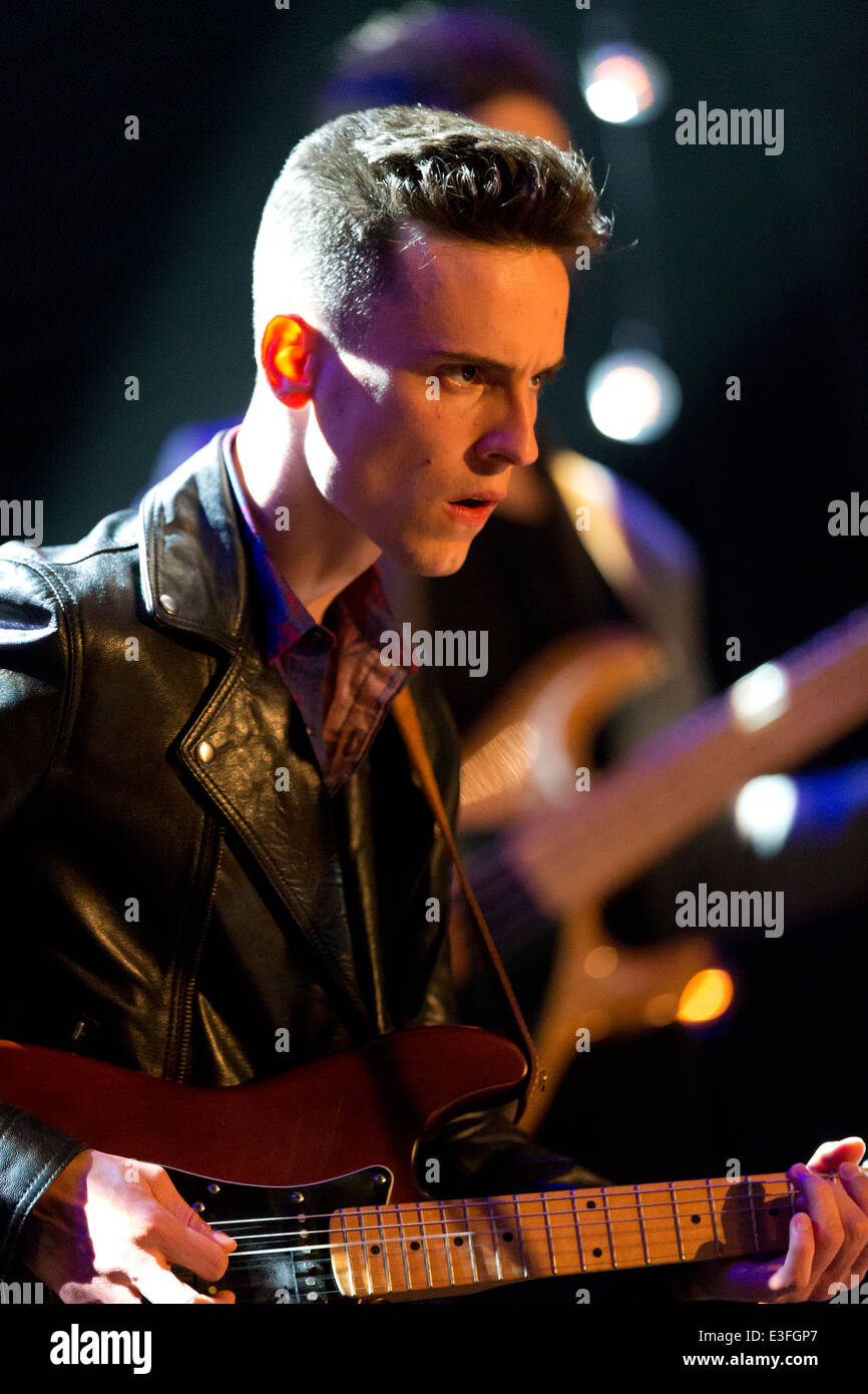 Singer performance standing guitar music spotlight illuminated hi-res ...