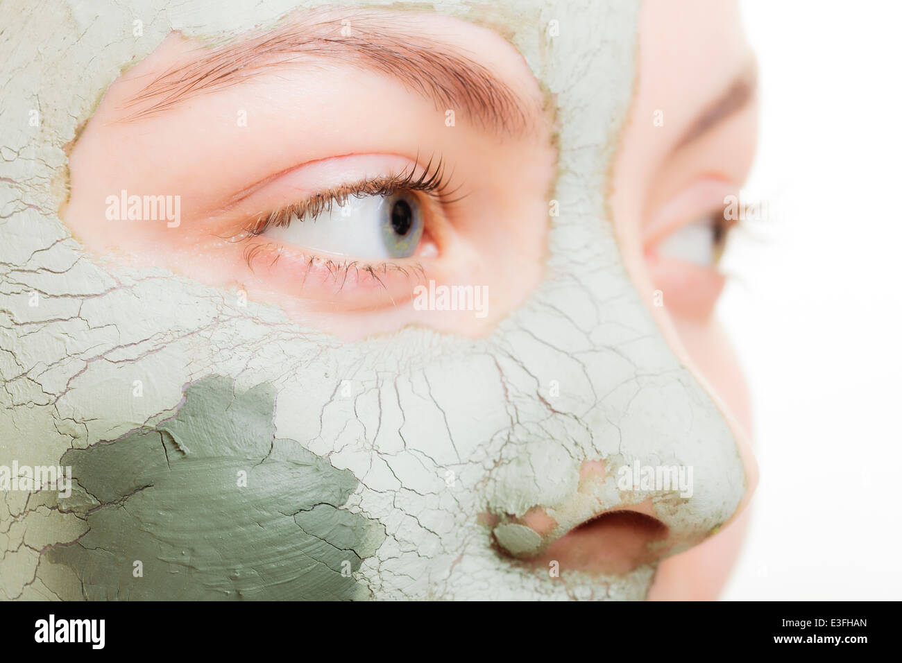 Skin care. Woman applying clay mask on face. Spa Stock Photo - Alamy