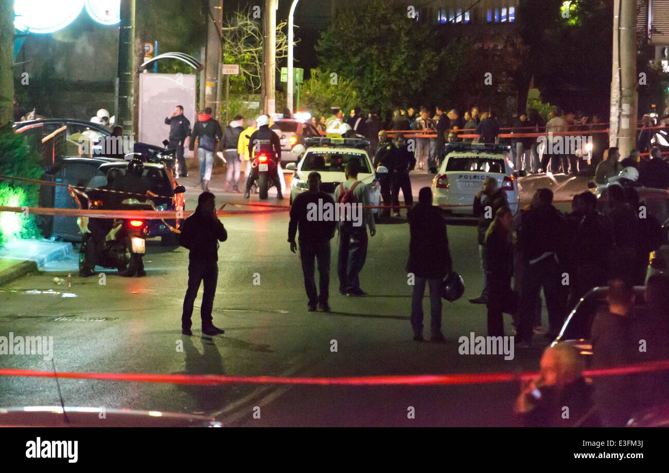 Police forces secure the crime scene outside the Golden Dawn offices as ...