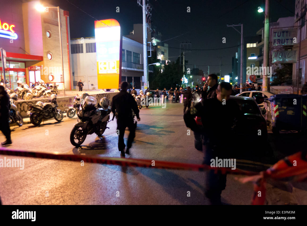Police forces secure the crime scene outside the Golden Dawn offices as ...