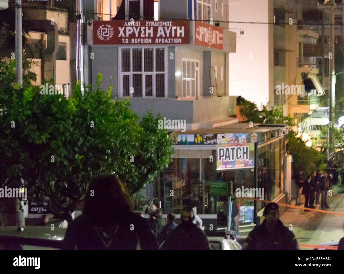 Police forces secure the crime scene outside the Golden Dawn offices as ...