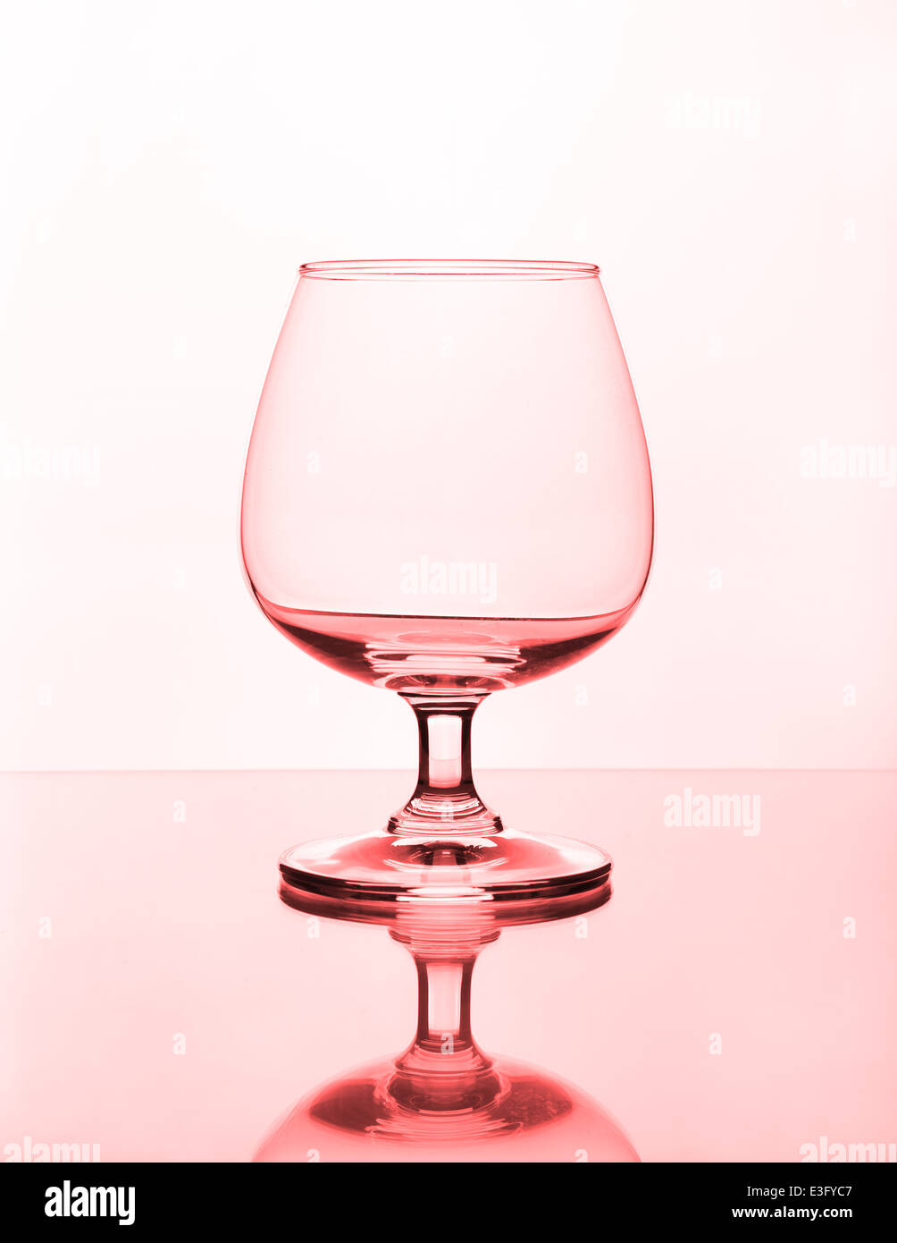 empty wine glass on glass table Stock Photo - Alamy