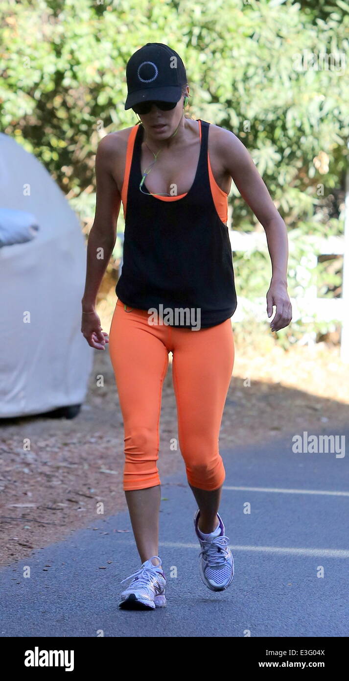 Eva Longoria goes for a morning run in Los Angeles wearing orange ...