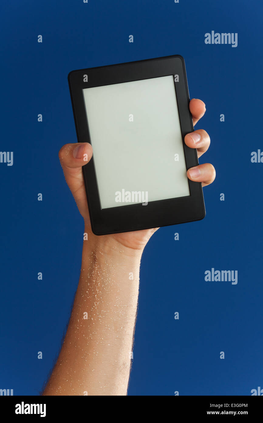 Electronic book in hand Stock Photo - Alamy